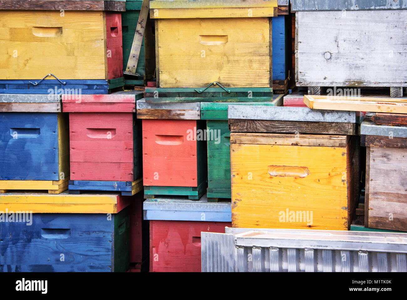 Pile of colorful beehives background Stock Photo - Alamy