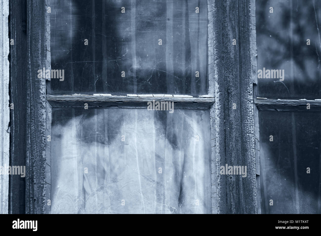 Horror - female ghost at the old grunge window Stock Photo - Alamy