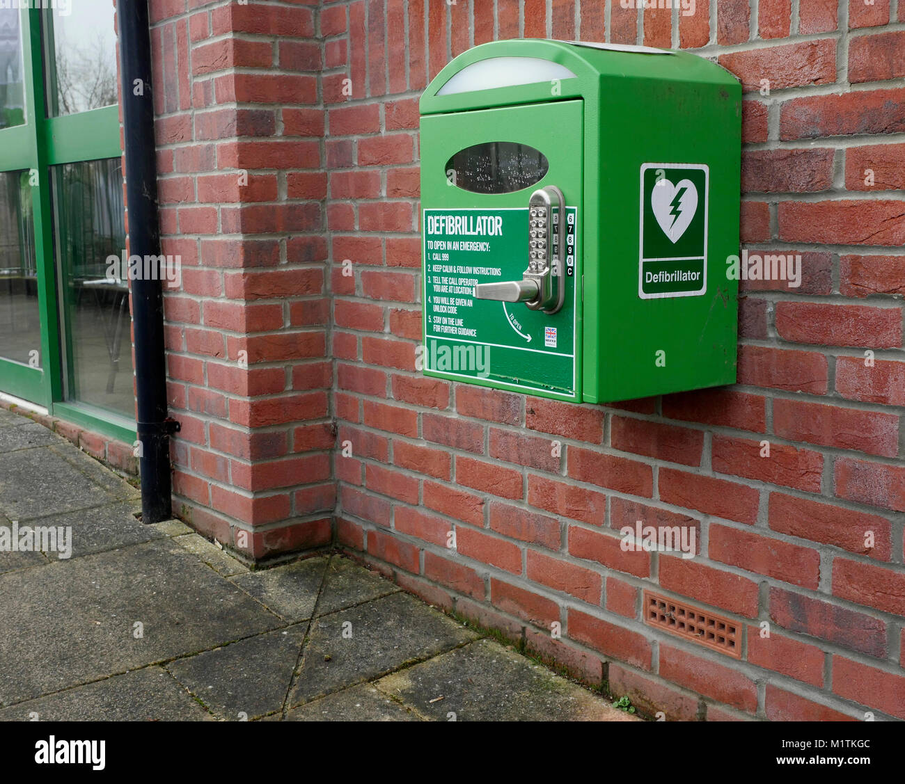 Wall mounted defibrillator in a box outside Lyndhurst Community Centre ...