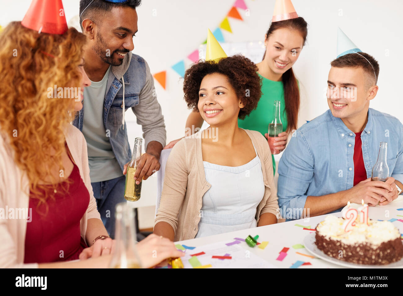 team greeting colleague at office birthday party Stock Photo - Alamy