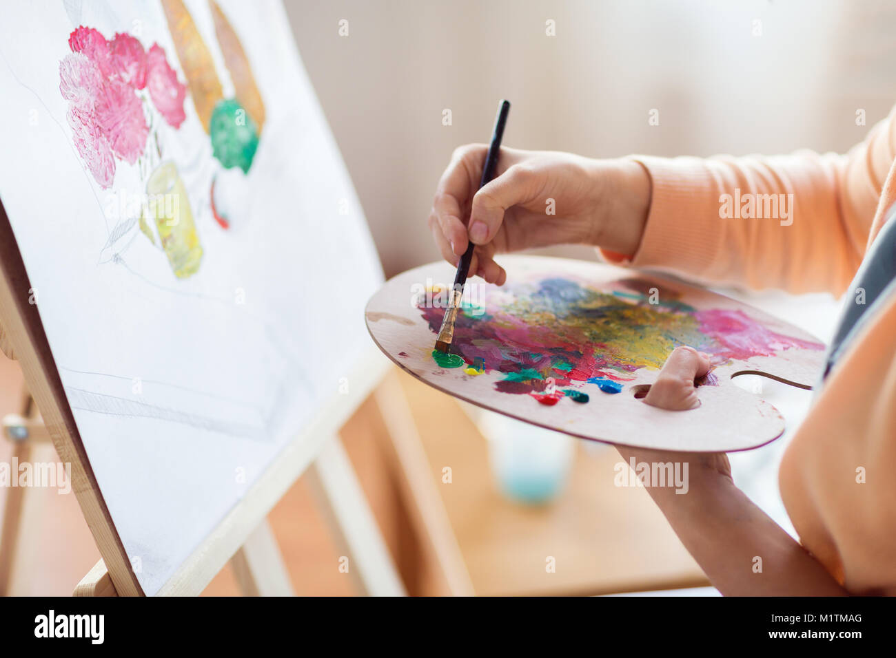 artist with palette painting at art studio Stock Photo - Alamy