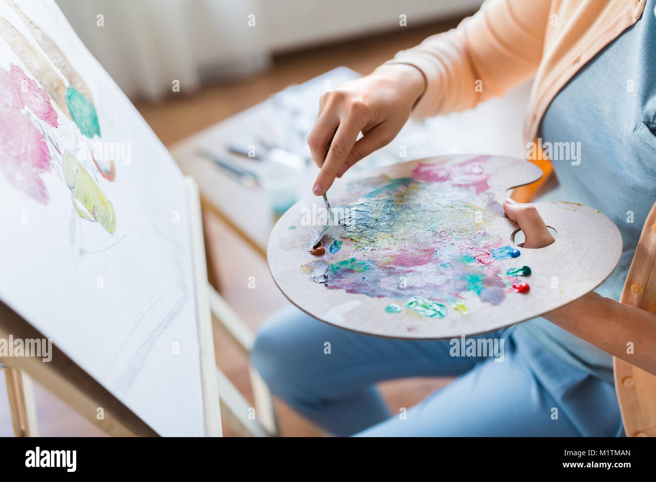 artist with palette knife painting at art studio Stock Photo - Alamy