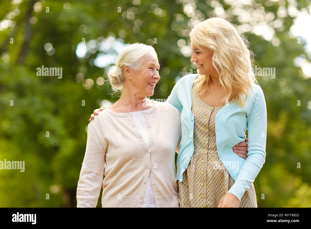Young mother hugging daughter hi-res stock photography and images - Alamy