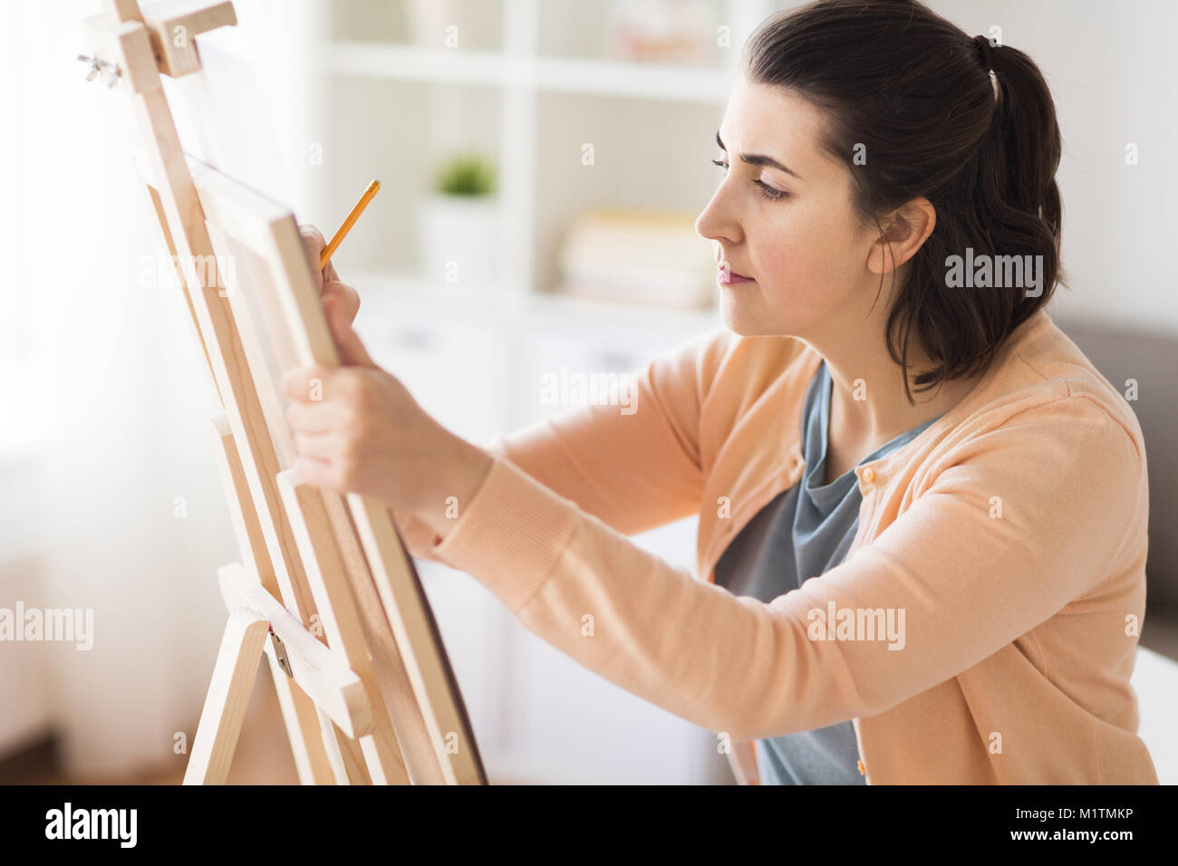 artist with pencil drawing picture at art studio Stock Photo - Alamy