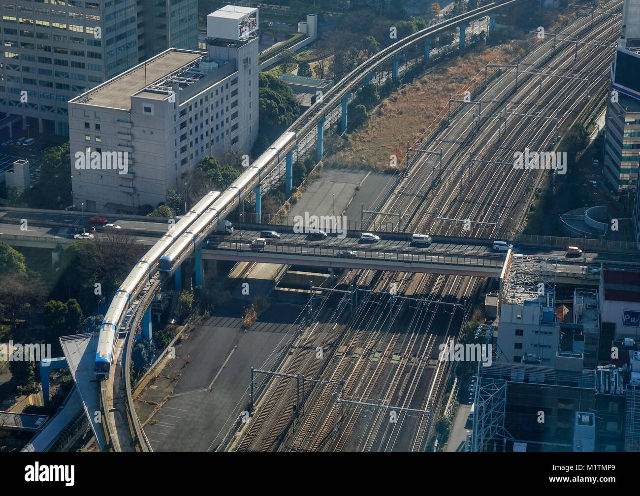 Tokyo, Japan - Jan 4, 2016. Trains running on rail tracks in Tokyo ...