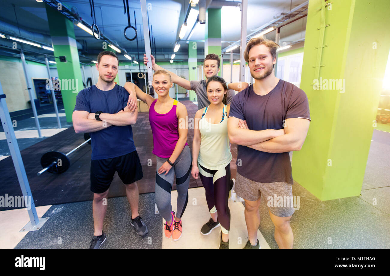 group of happy friends in gym Stock Photo - Alamy
