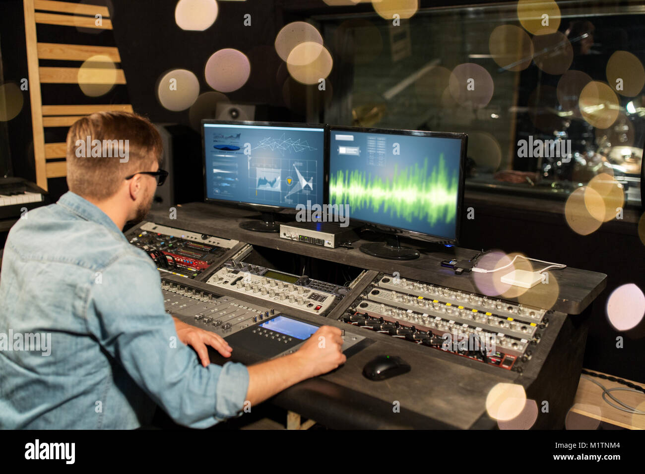 man at mixing console in music recording studio Stock Photo - Alamy