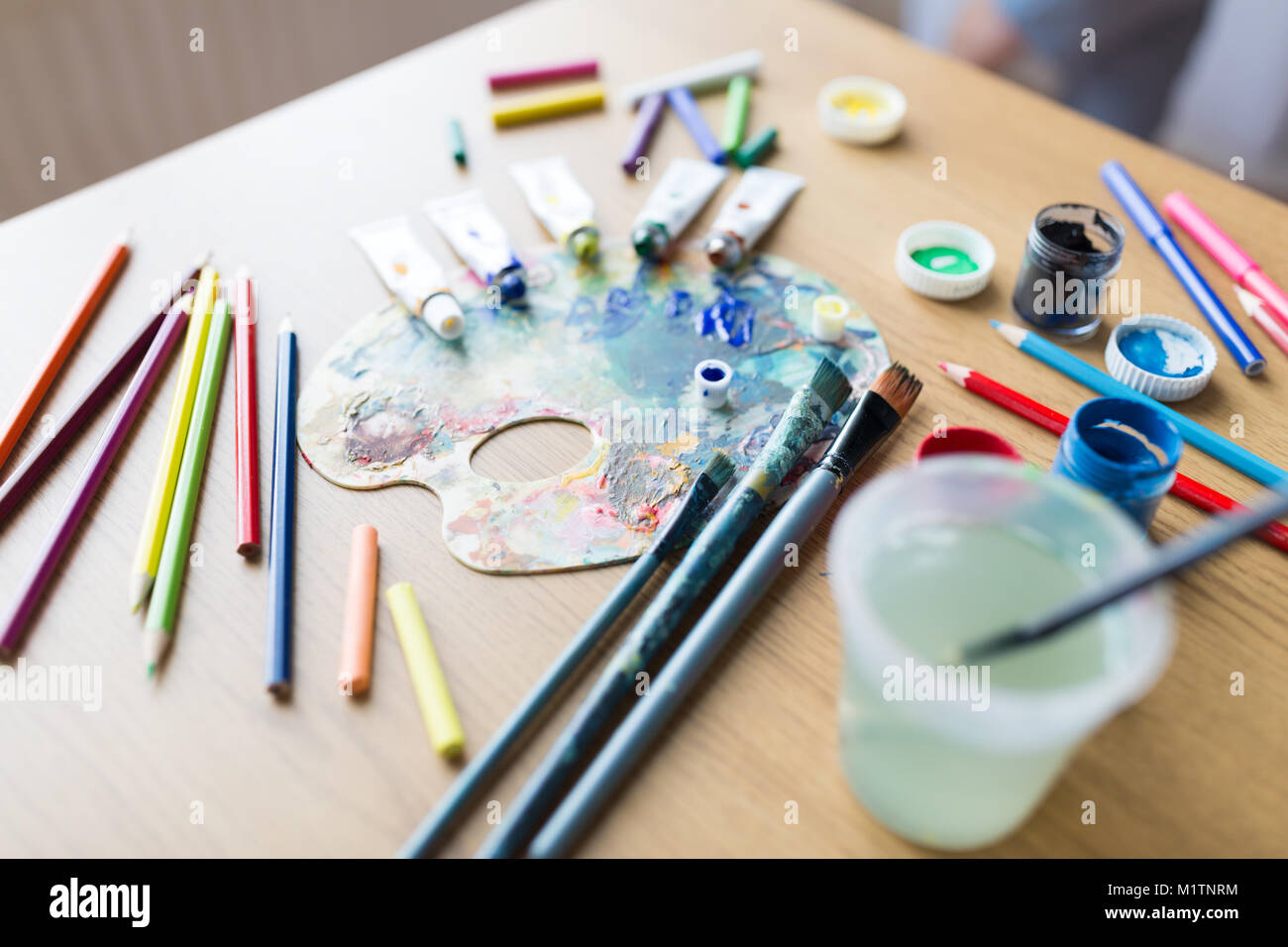 color palette, brushes and paint tubes on table Stock Photo - Alamy
