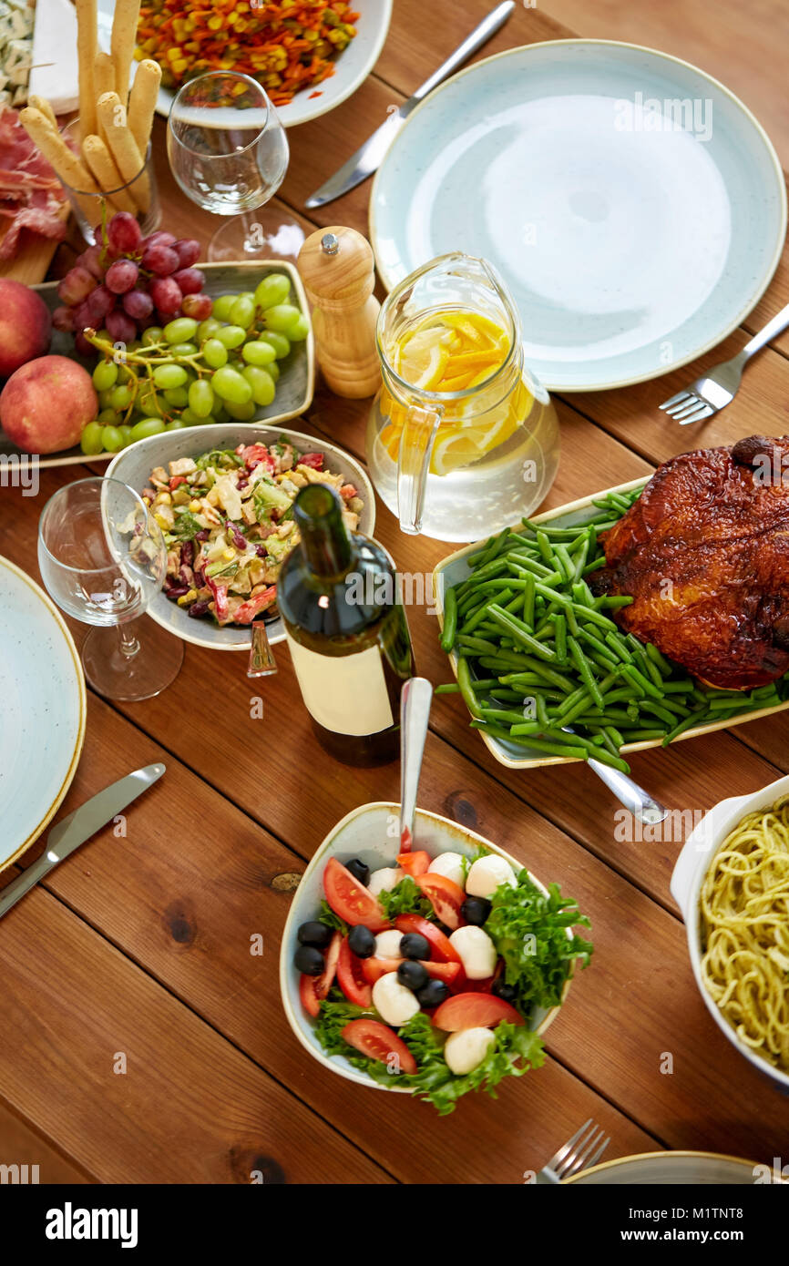 various food on served wooden table Stock Photo - Alamy