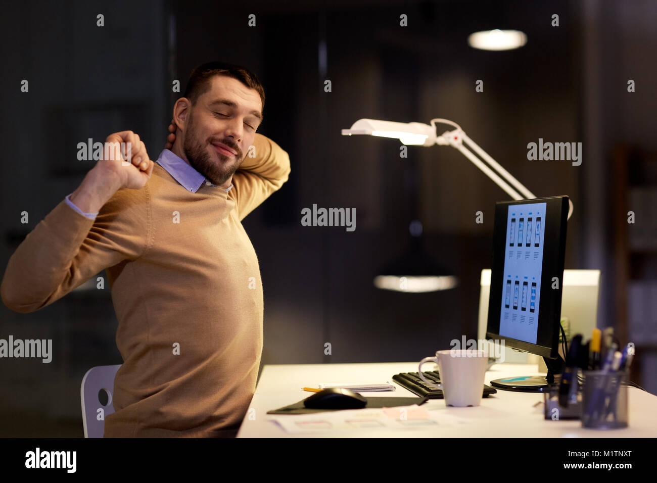 man with computer working late at night office Stock Photo - Alamy