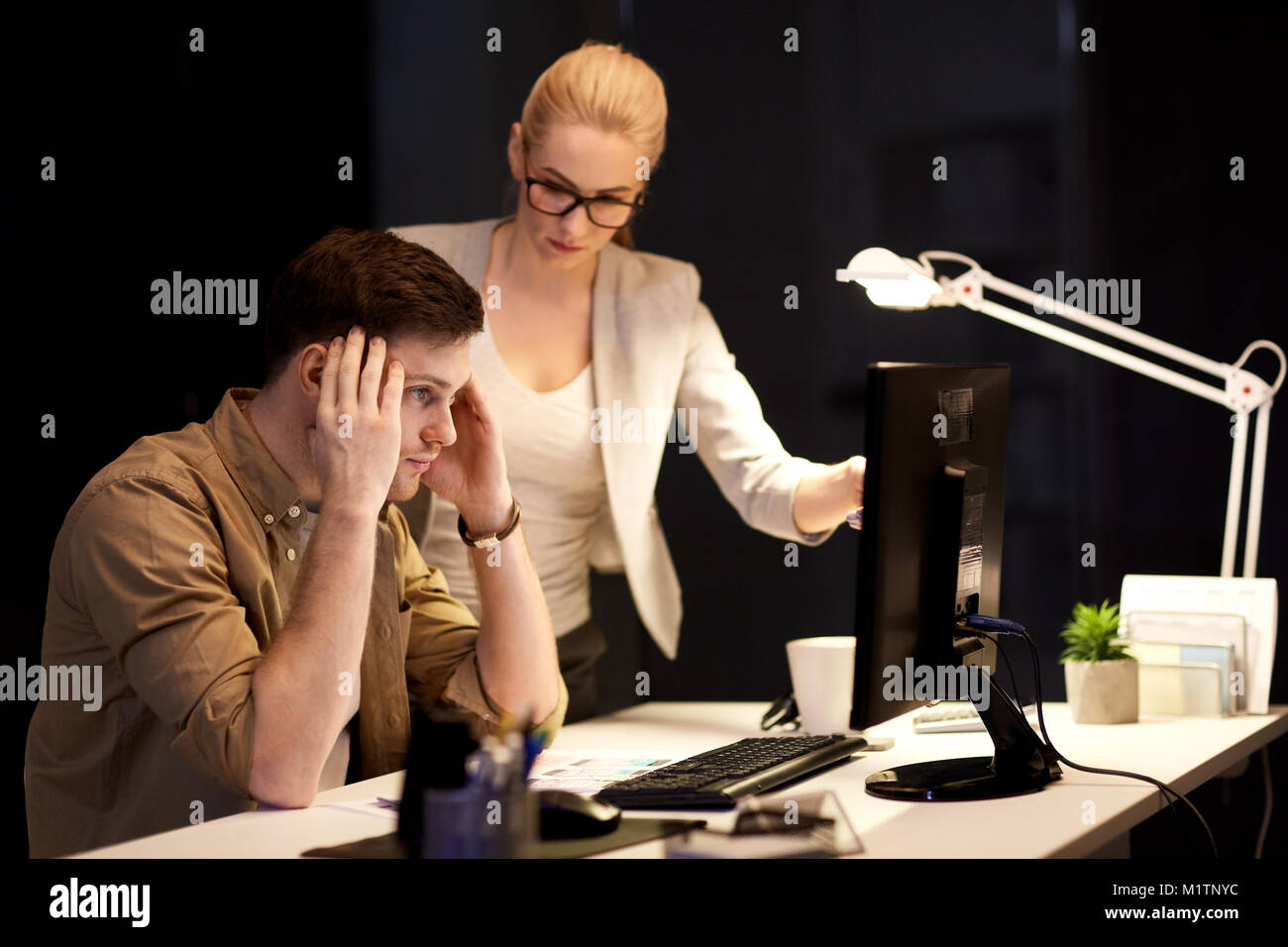 business team with computer working late at office Stock Photo - Alamy