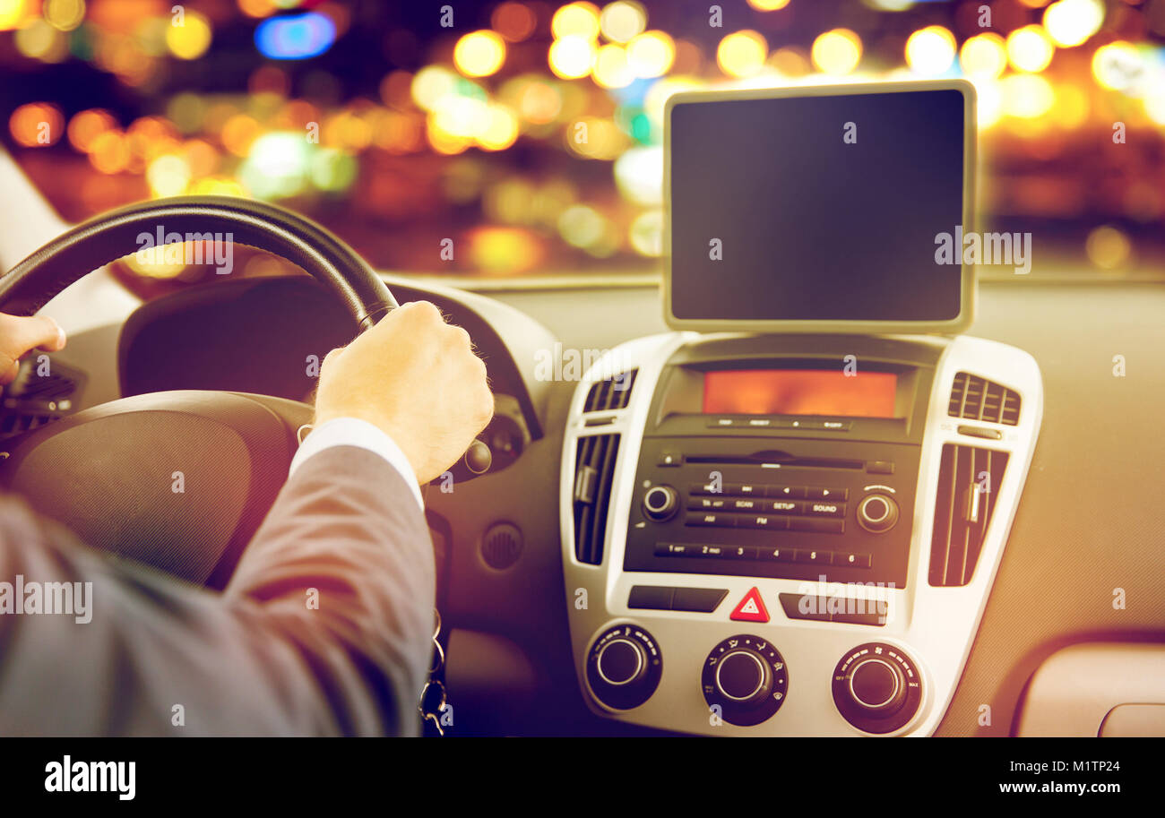 close up of young man with tablet pc driving car Stock Photo - Alamy