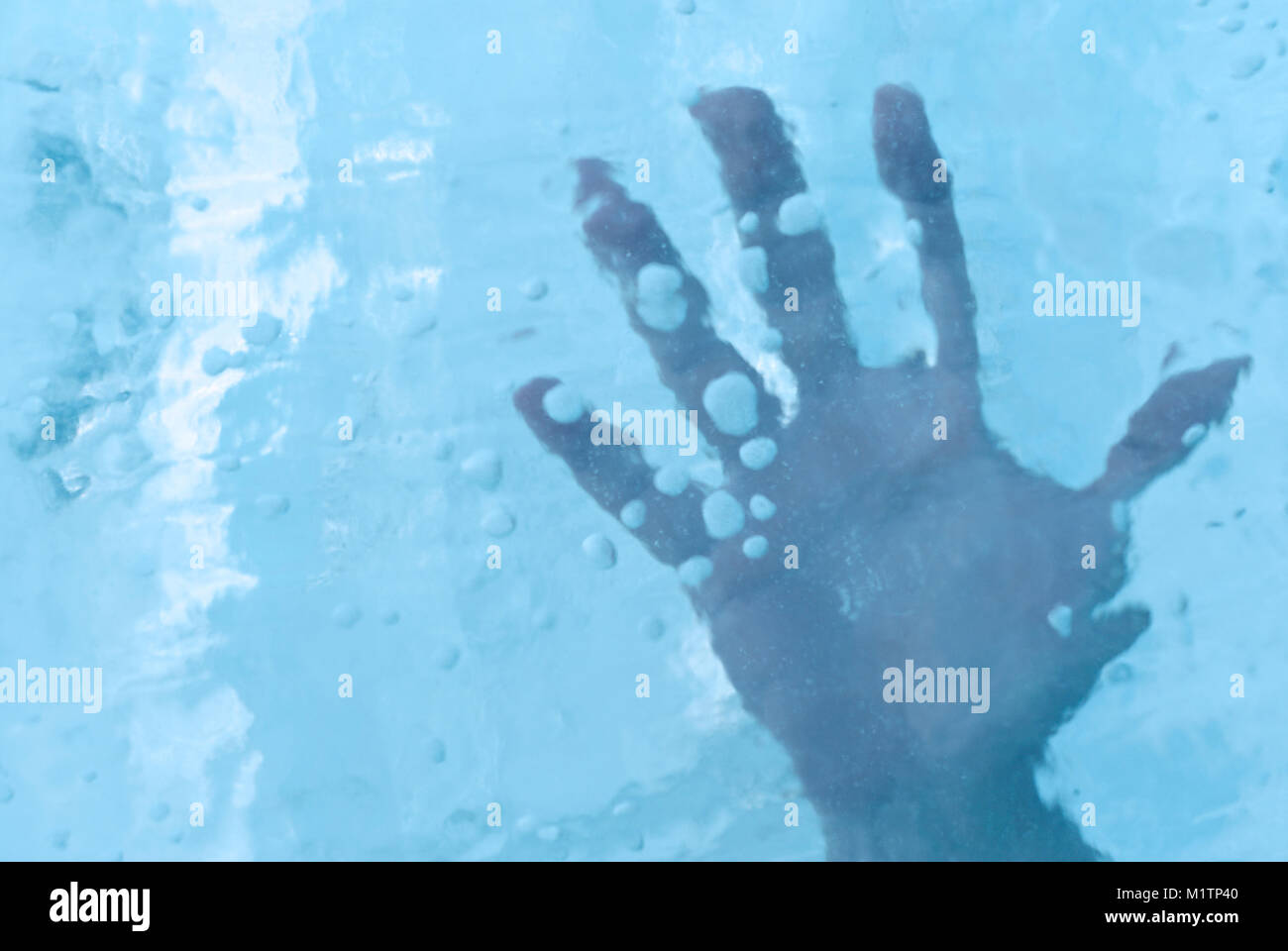 human hand in ice or under the ice surface Stock Photo - Alamy