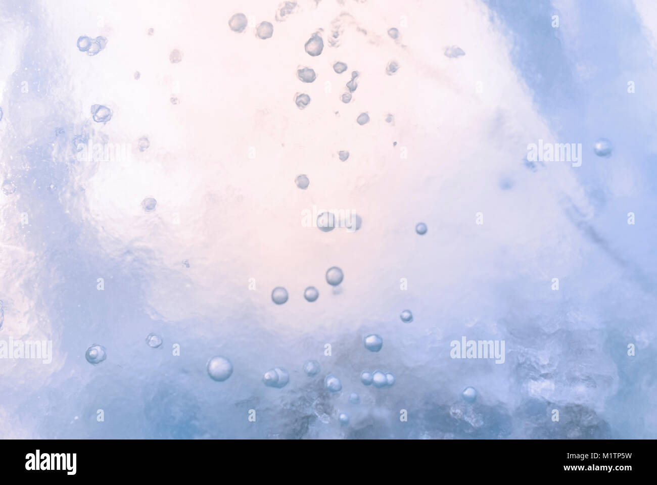 background, texture: translucent blue ice surface with air bubbles ...