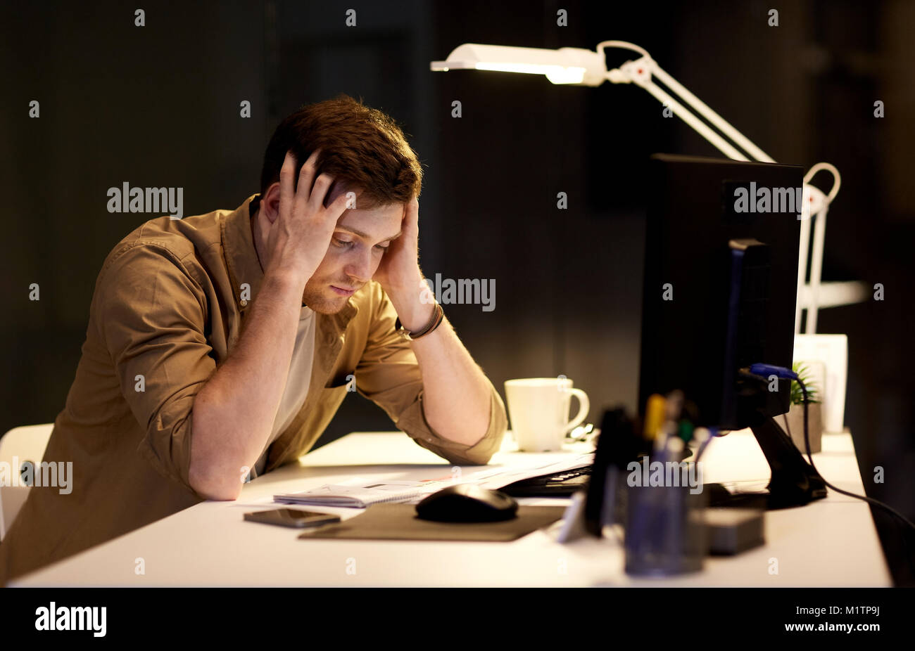 man with computer working late at night office Stock Photo - Alamy
