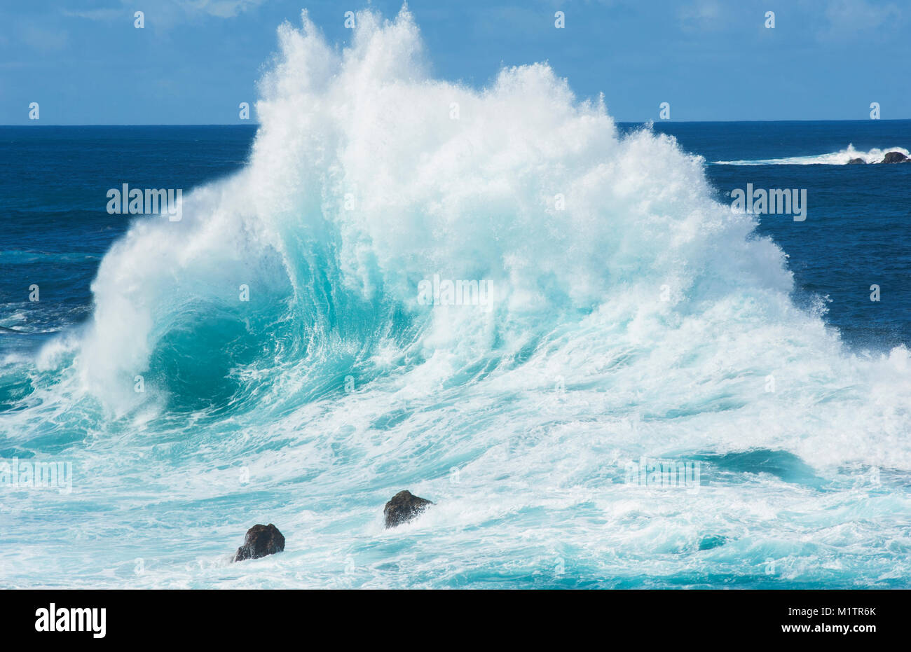Large wave breaking over a reef - John Gollop Stock Photo - Alamy