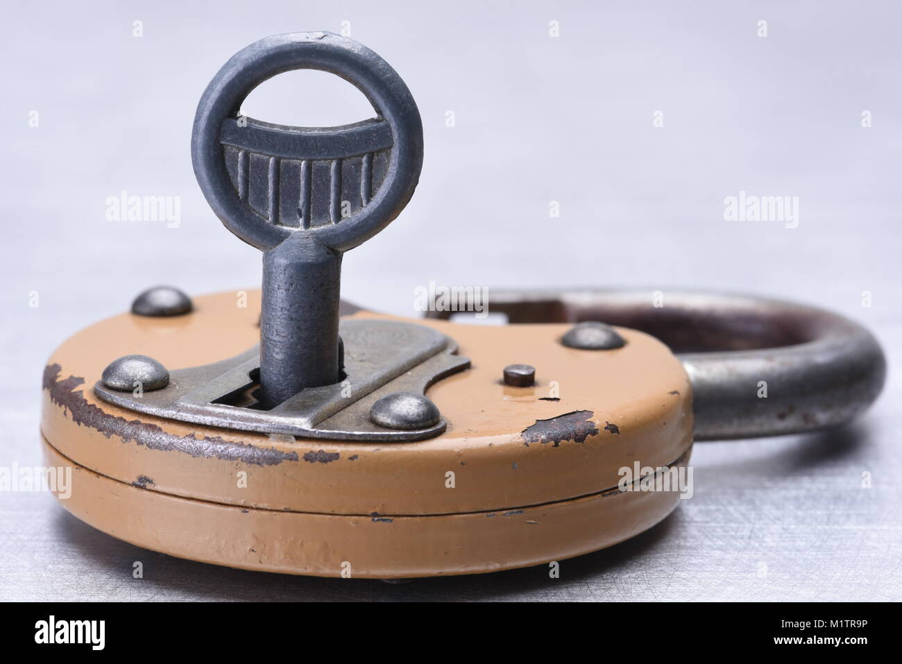 Old rusty padlock with key Stock Photo - Alamy