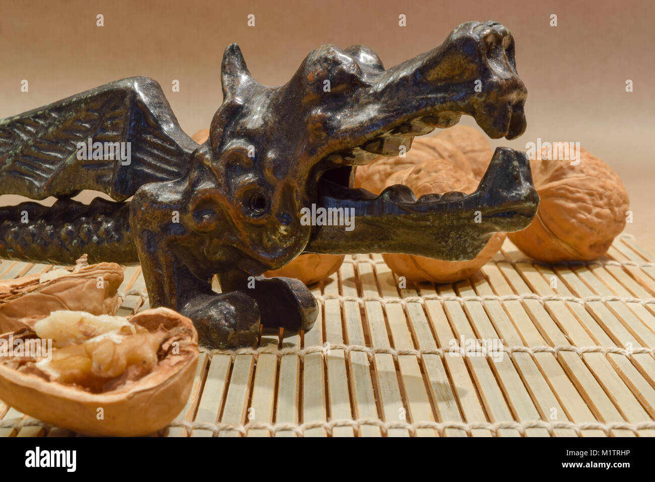 Very old dragon shape nutcracker with the walnut in jaws Stock Photo ...
