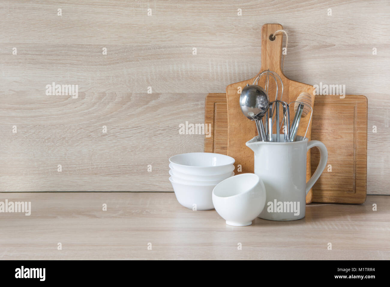 Crockery, tableware, utensils and other different stuff on wooden table ...
