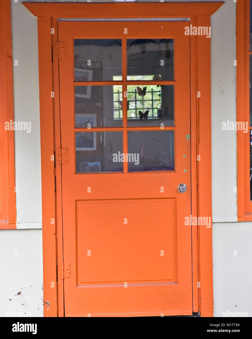 orange door with windows Stock Photo - Alamy