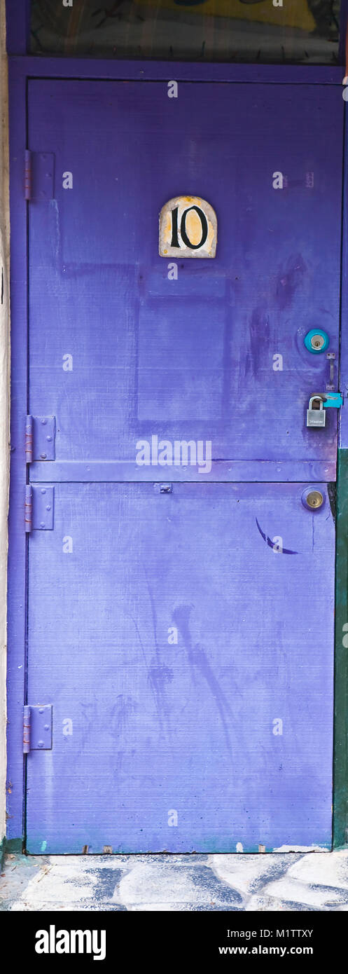 blue door with padlock and number Stock Photo - Alamy