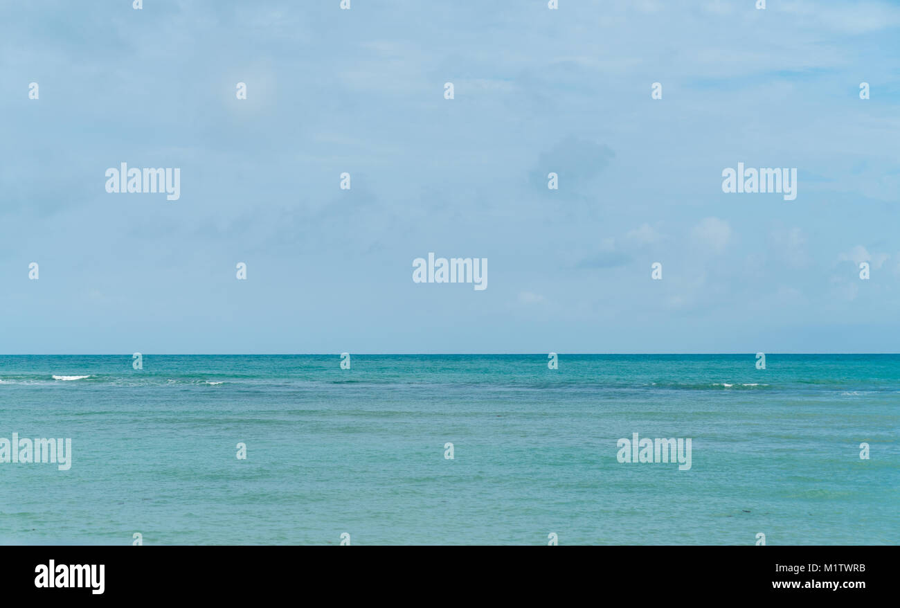 Blue sea to horizon and sky simple background image Stock Photo - Alamy