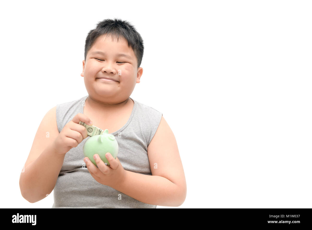 Happy Obese boy smile and holding piggy bank on hand isolated on white ...