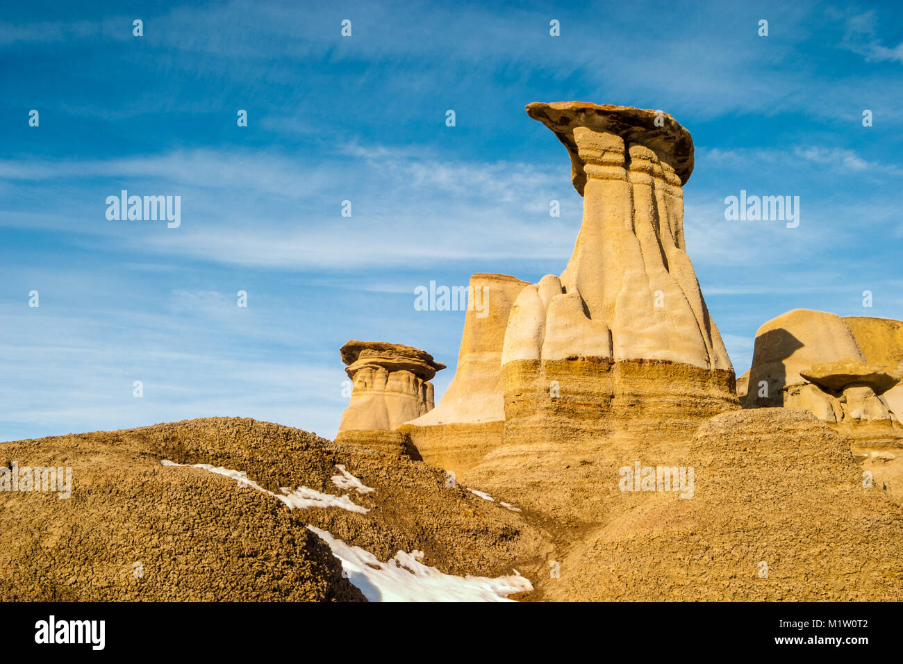 Hoodoos, a geologic formation on a bright day in the badlands near ...