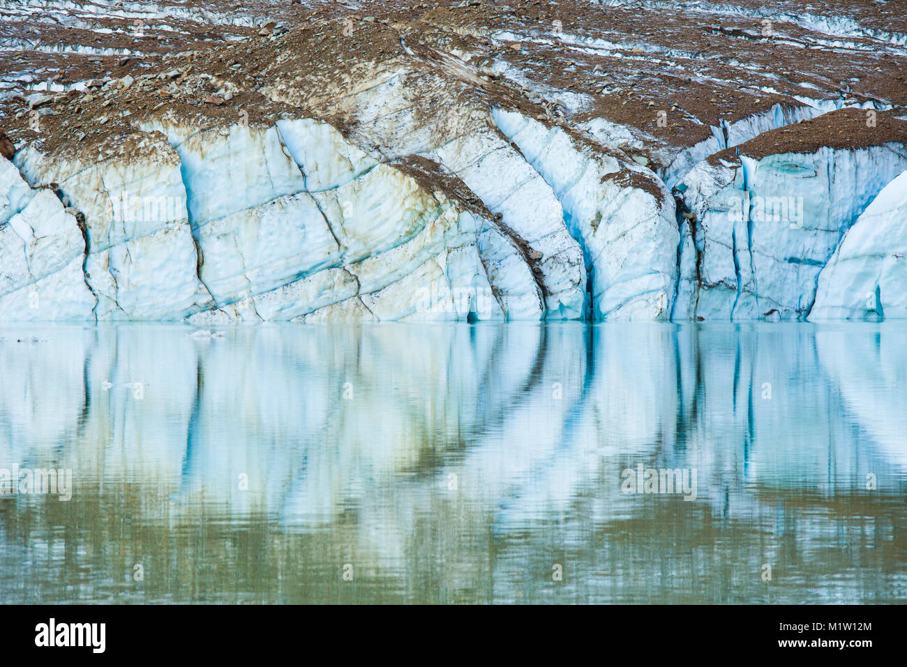 Glacier and it's reflection in a melt water lake Stock Photo - Alamy