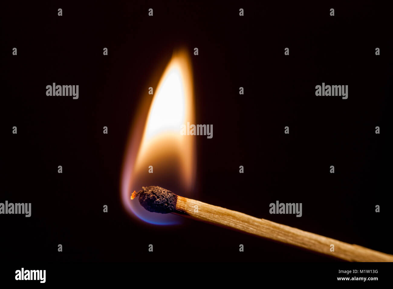 Single lit match on a dark background Stock Photo - Alamy