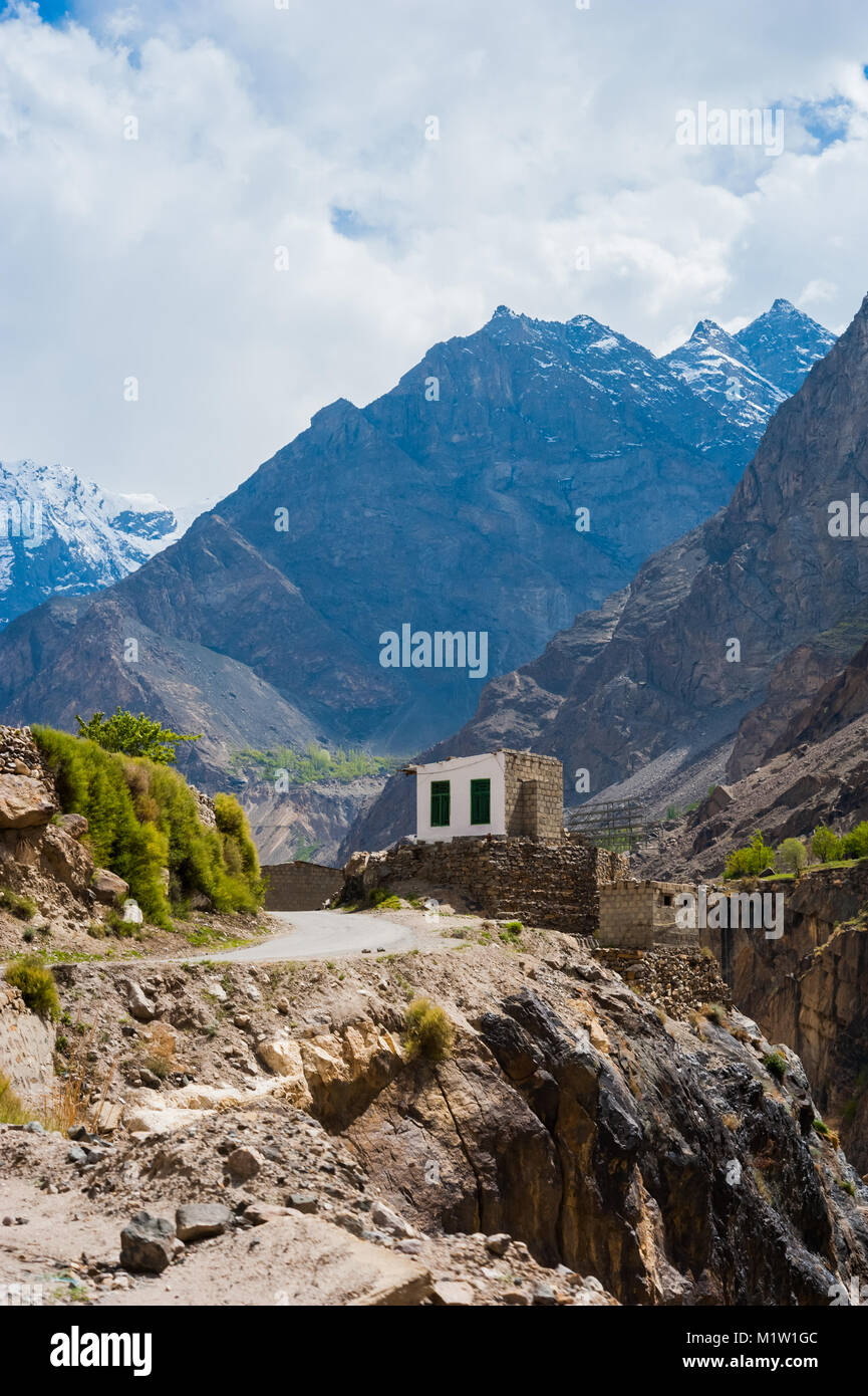 Village with traditional stone houses scattered on the mountain side in ...