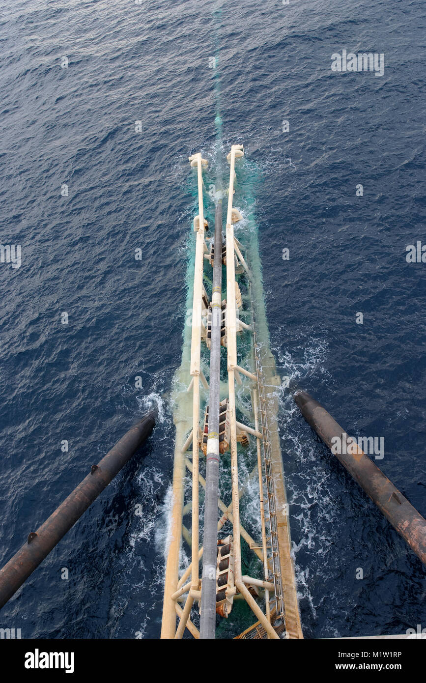 A pipeline Stinger and pipeline being deployed to the seabed Stock Photo - Alamy
