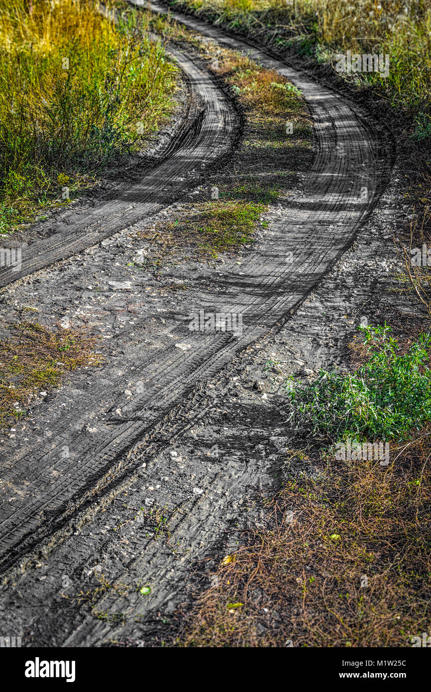 The rural dirt road goes into the distance Stock Photo - Alamy