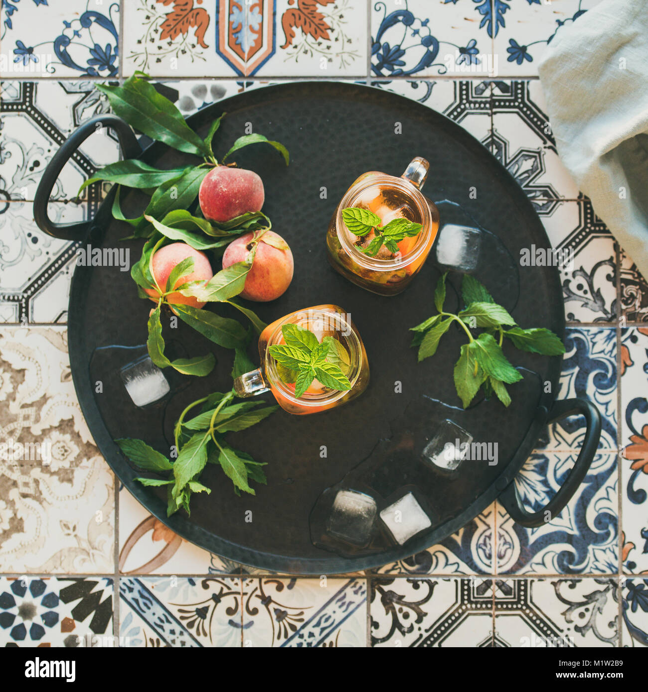 Summer refreshing cold peach ice tea in jars, top view Stock Photo - Alamy