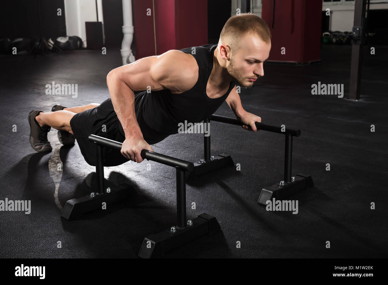 Young Athlete Man Doing Push-up Exercise In The Gym Stock Photo - Alamy