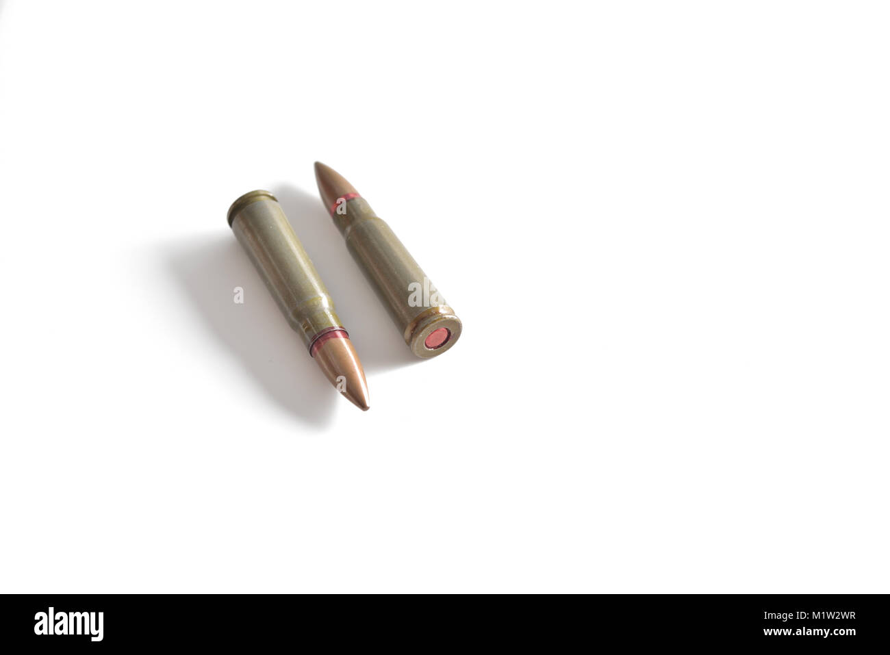 Two rifle bullets isolated on a white background. Military ammunition ...