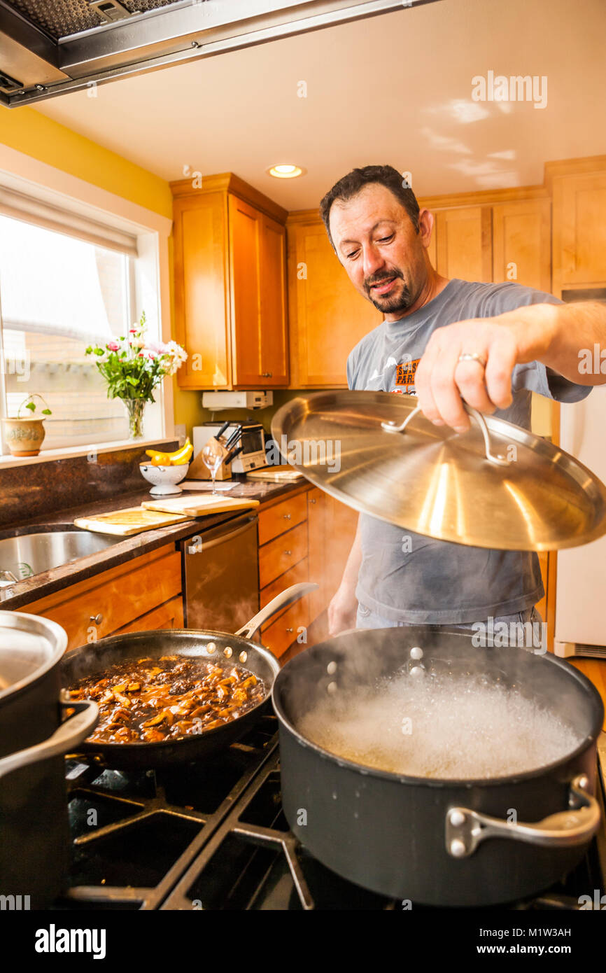 Picking up pot stove hi-res stock photography and images - Alamy