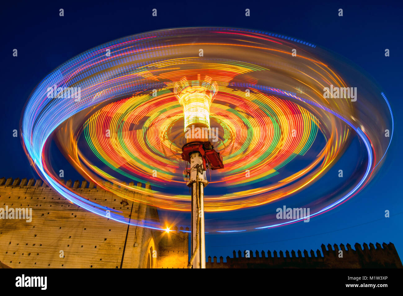 Motion blur of spinning machine for circle ride in amusement park Stock ...