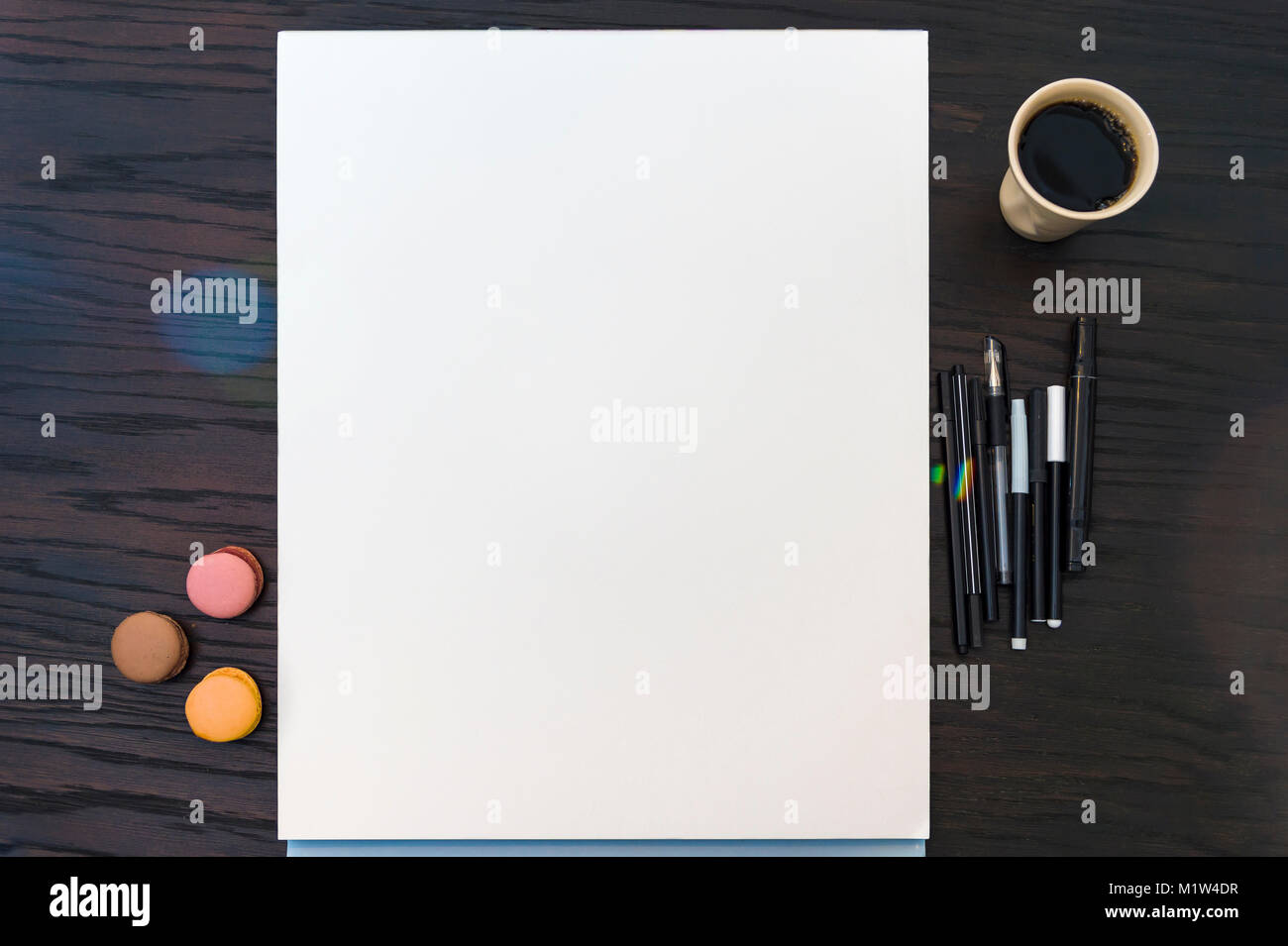 Background for creative pictures - Large paper block on dark oak table ...