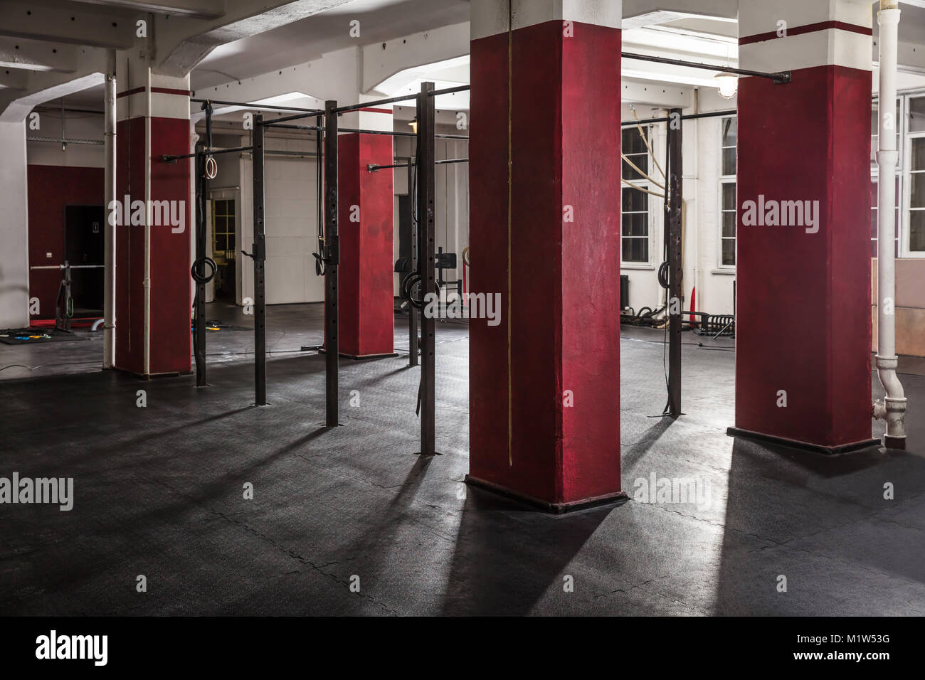 An Interior Of An Empty Gym With Exercise Equipment Stock Photo - Alamy