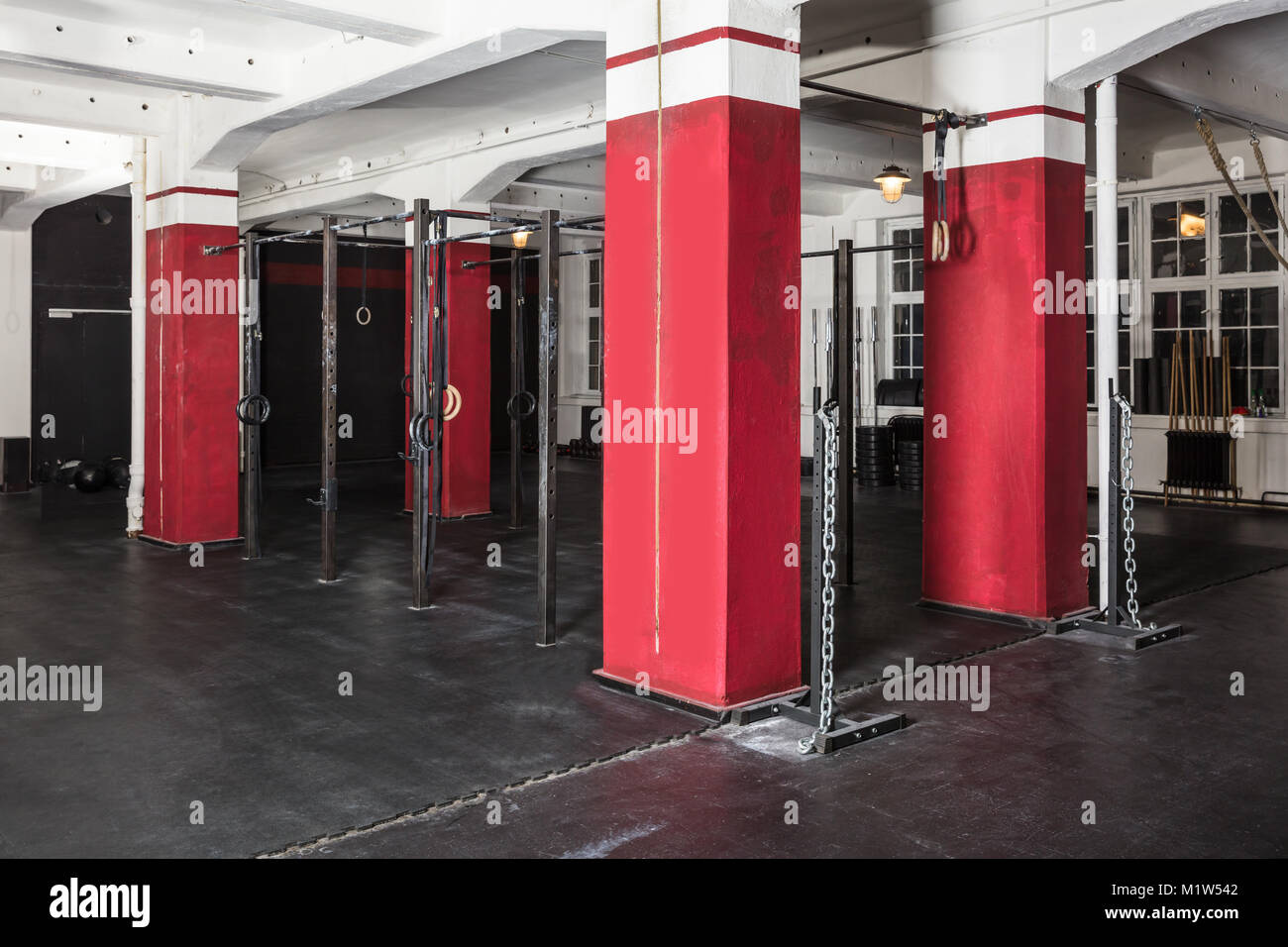 An Interior Of An Empty Gym With Exercise Equipment Stock Photo - Alamy