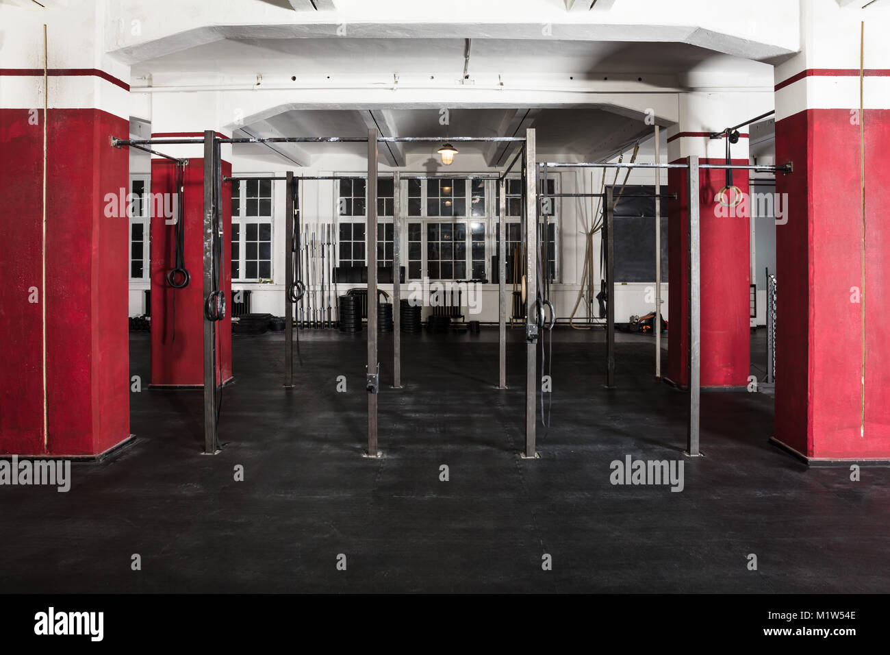 An Interior Of An Empty Gym With Exercise Equipment Stock Photo - Alamy