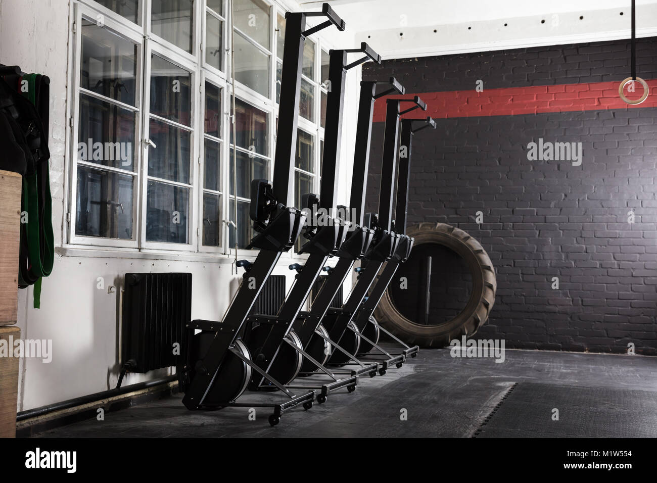 Row machines Standing In An Empty Gym Stock Photo - Alamy