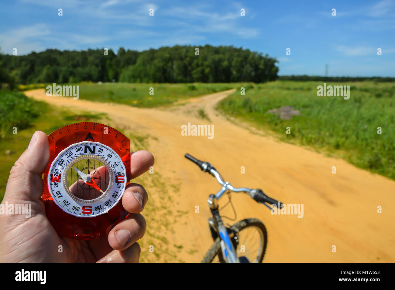 Compass in hand. Orientation on a walk with a navigation device Stock ...