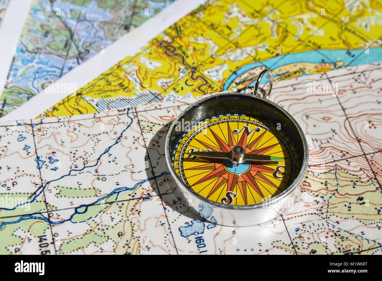 Compass on the map. Items necessary for orientation in travel Stock ...
