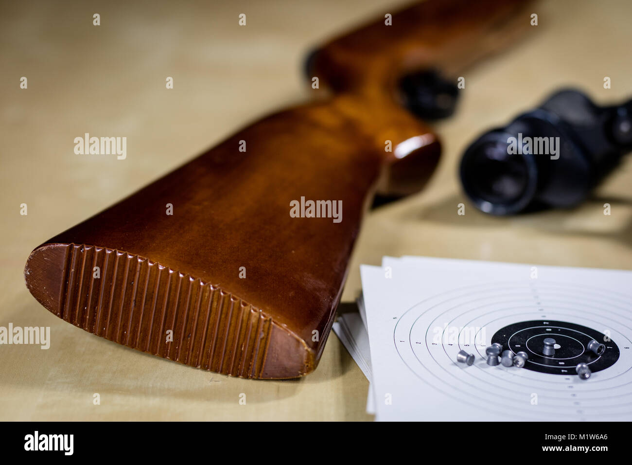 Shooting accessories on a wooden table in a shooting range. Shield and ...