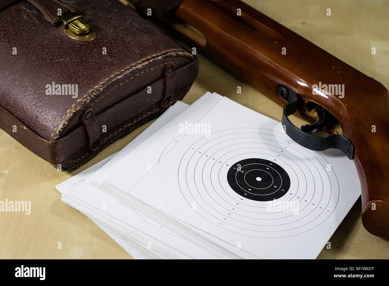 Shooting accessories on a wooden table in a shooting range. Shield and ...