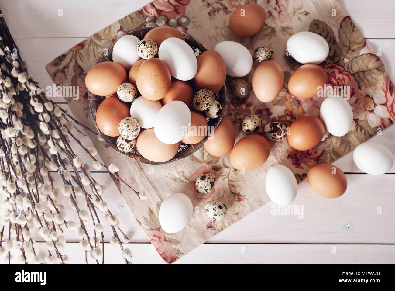 Different kinds of eggs on a wooden table Stock Photo - Alamy