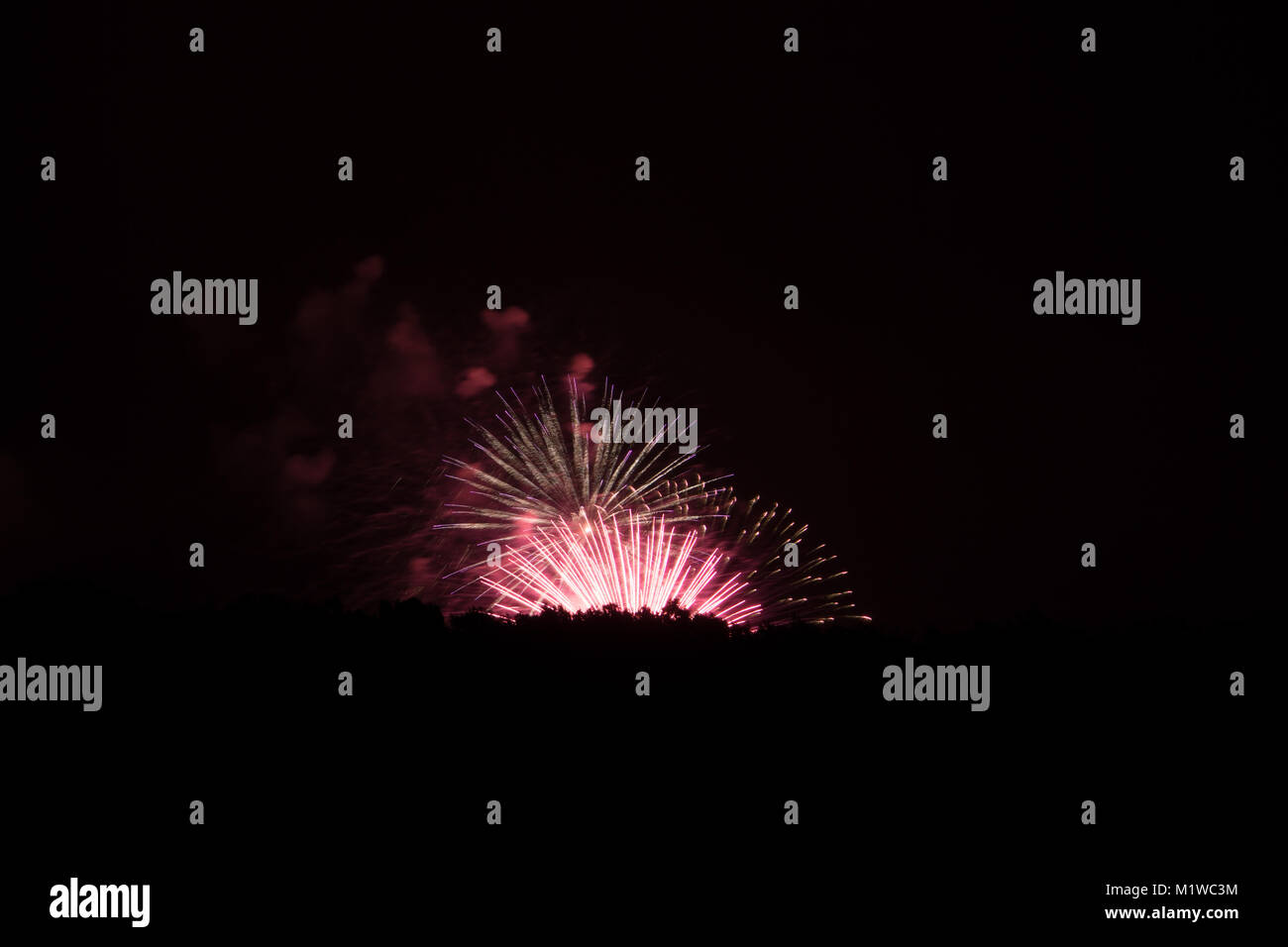 Beautiful red fireworks explosions at amazing party celebration Stock ...