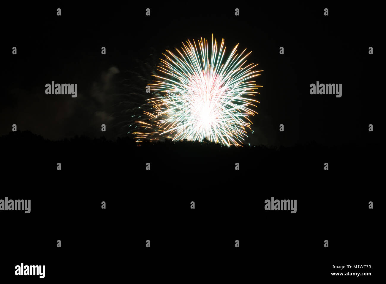 Two magic simultaneous fireworks explosions in white color Stock Photo ...